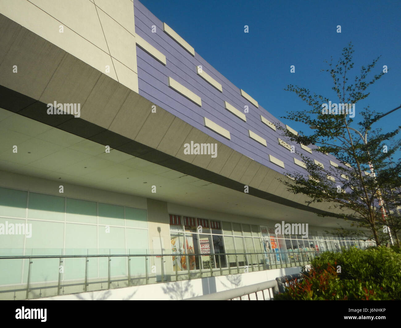 The image shows the exterior of SM City San Jose del Monte, a major ...