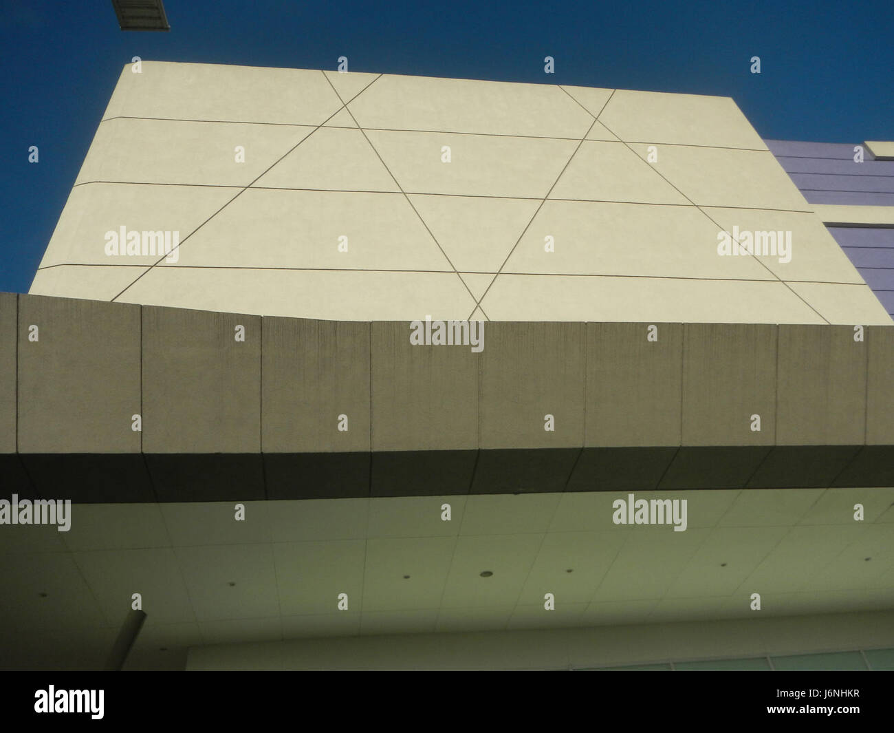 This image depicts the exterior of the SM City shopping mall in San ...