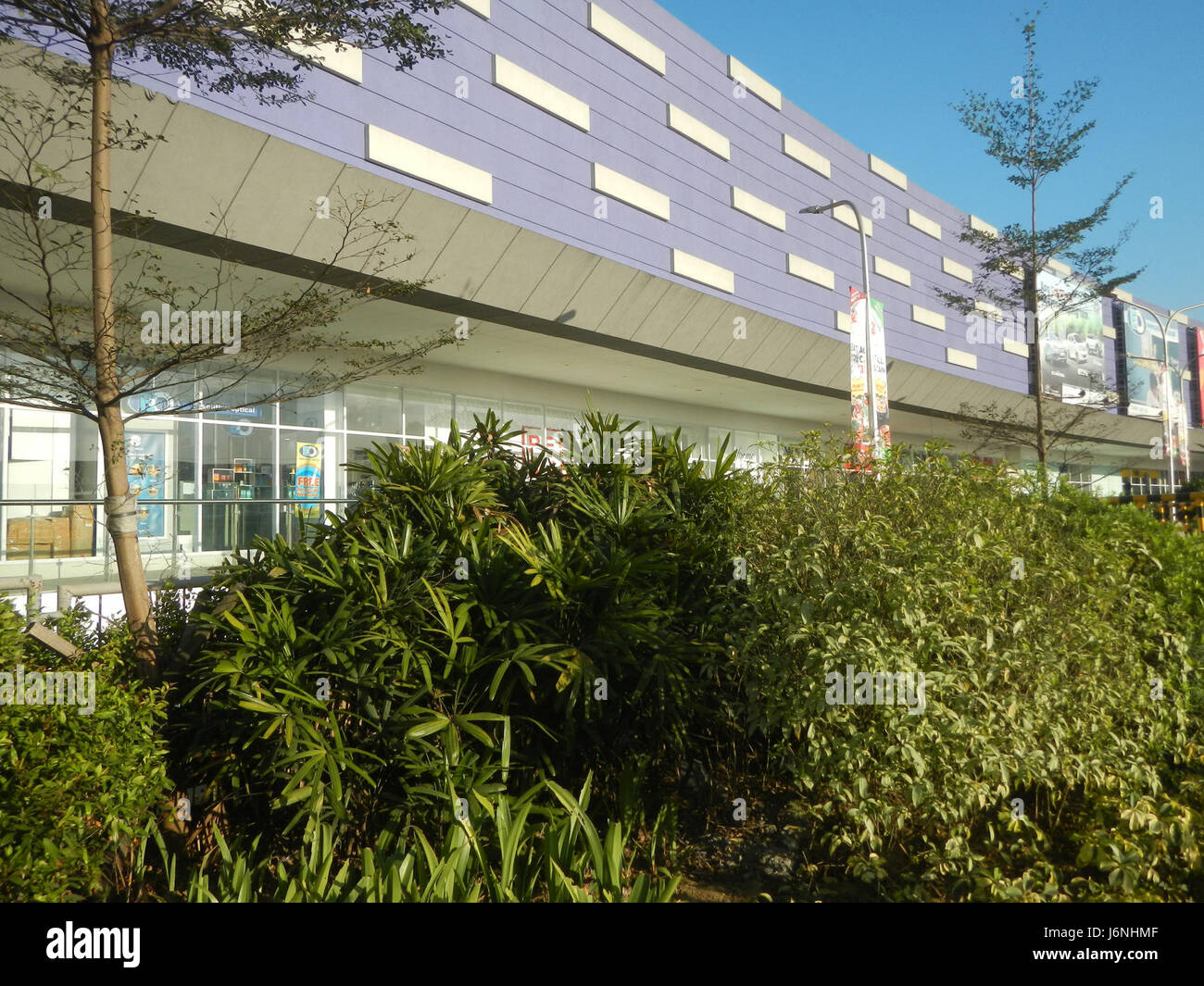 This photograph shows the exterior of the SM City mall in San Jose Del ...