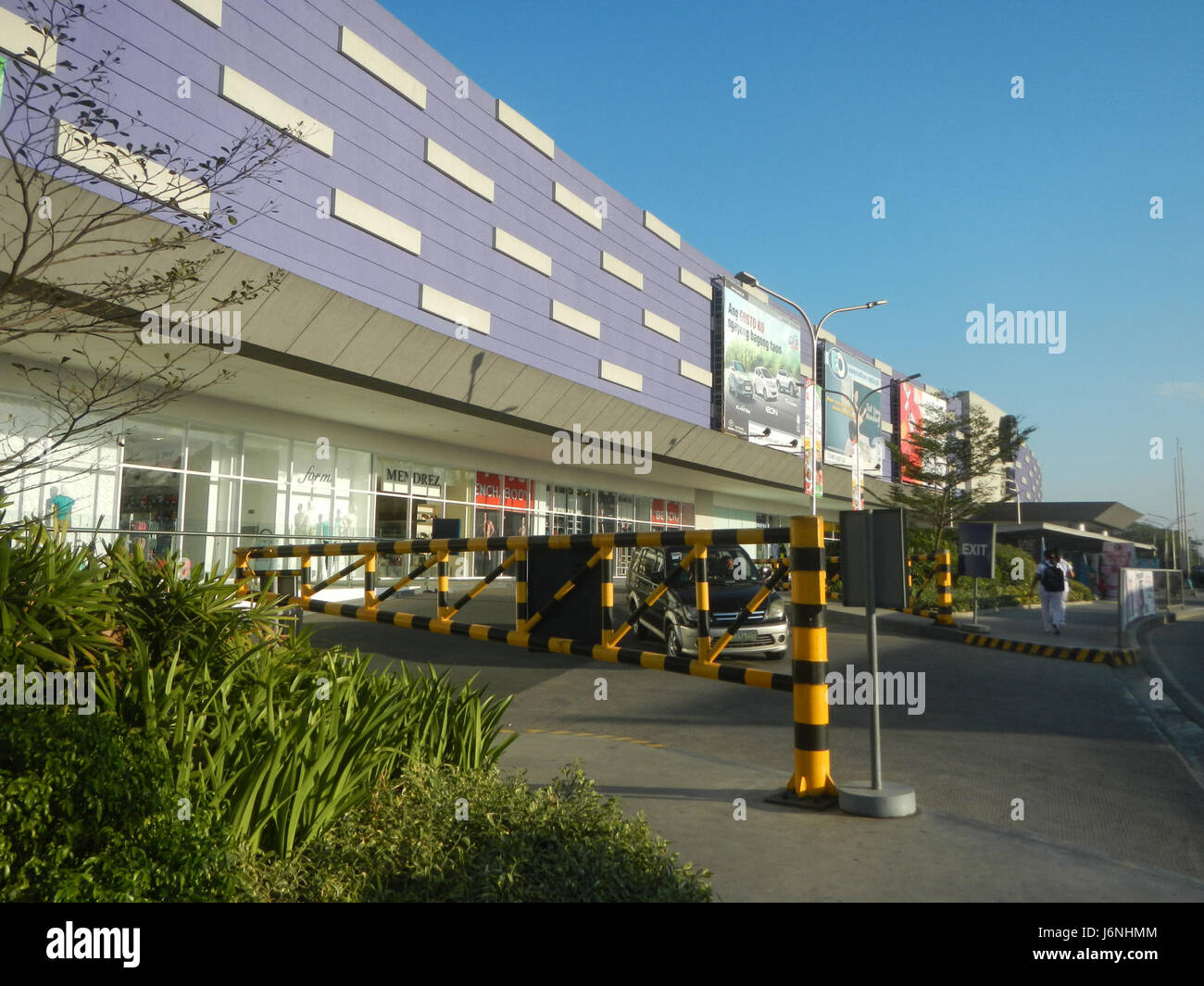 This image features the exterior of SM City San Jose del Monte, a major ...