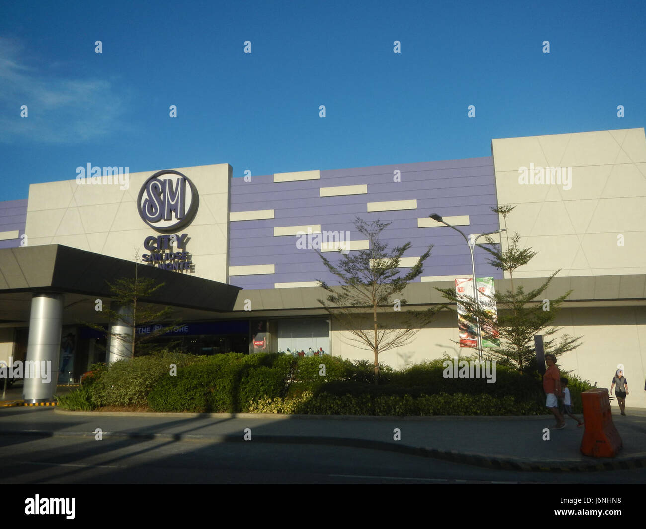 This image shows the exterior of SM City San Jose Del Monte, a ...