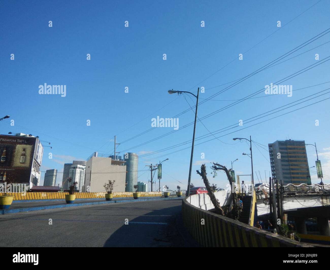 The image highlights a bridge connecting the cities of Makati and ...