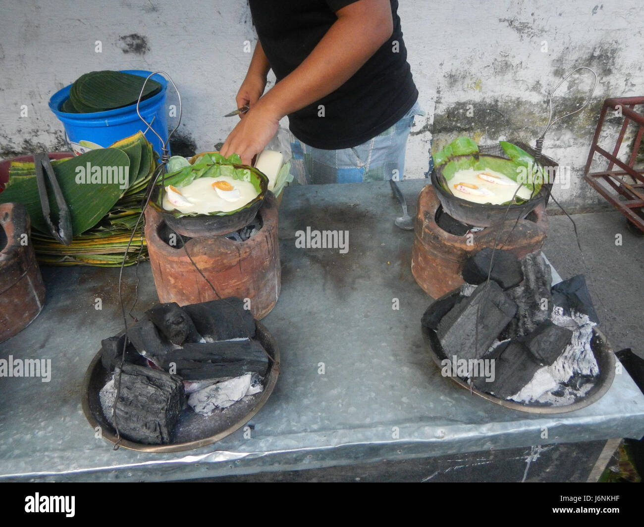 This image features traditional Filipino rice cakes, specifically Puto ...