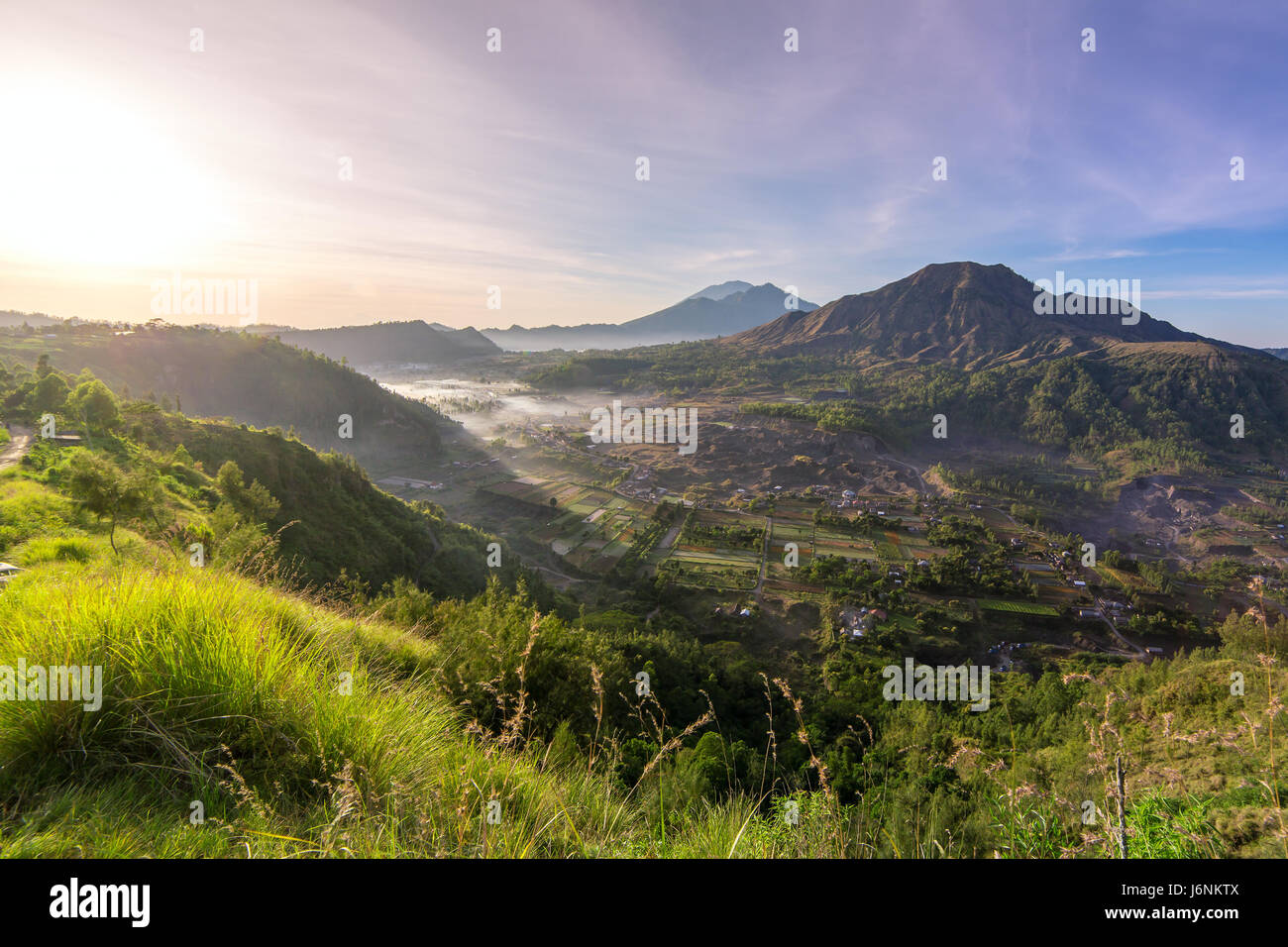 Sunrise over the caldera of Batur volcano in Bali, Indonesia Stock ...