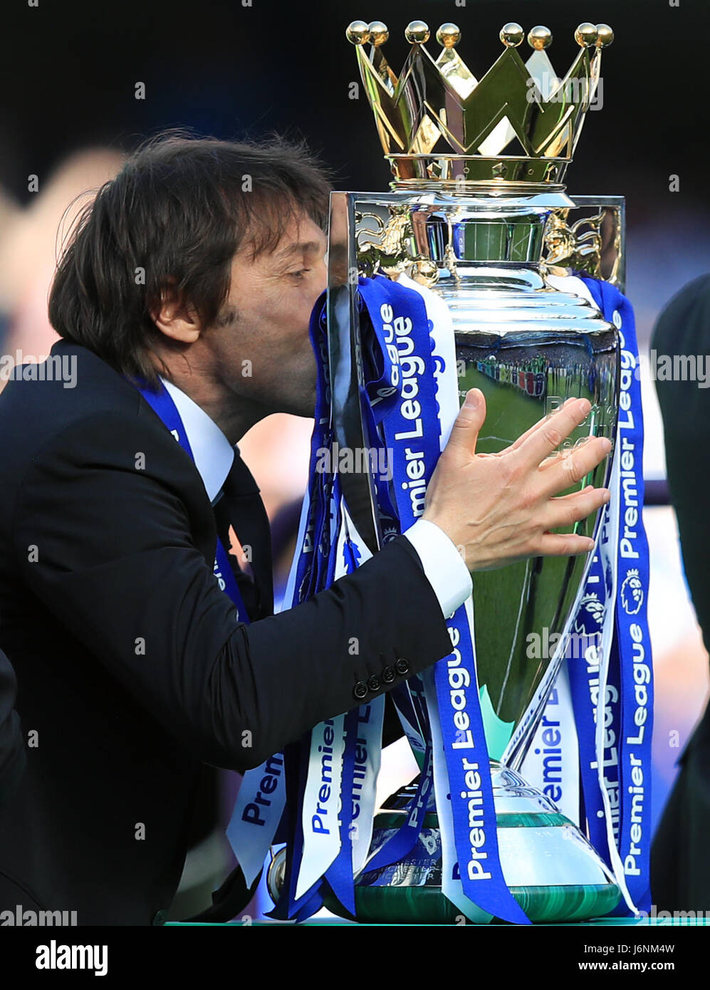 Chelsea manager Antonio Conte kisses the Premier League Trophy during ...
