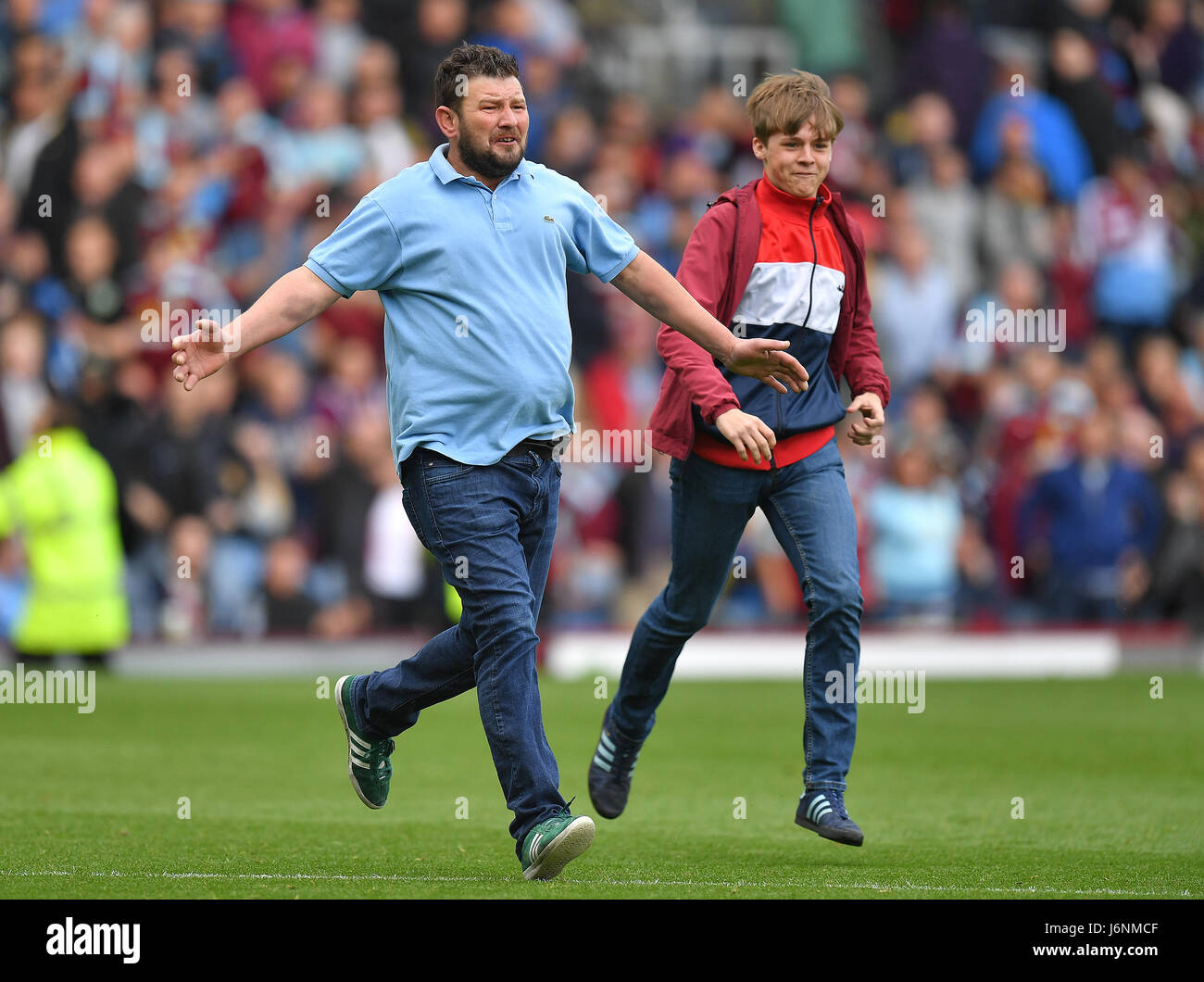 Fans invade the pitch after the Premier League match at Turf Moor ...