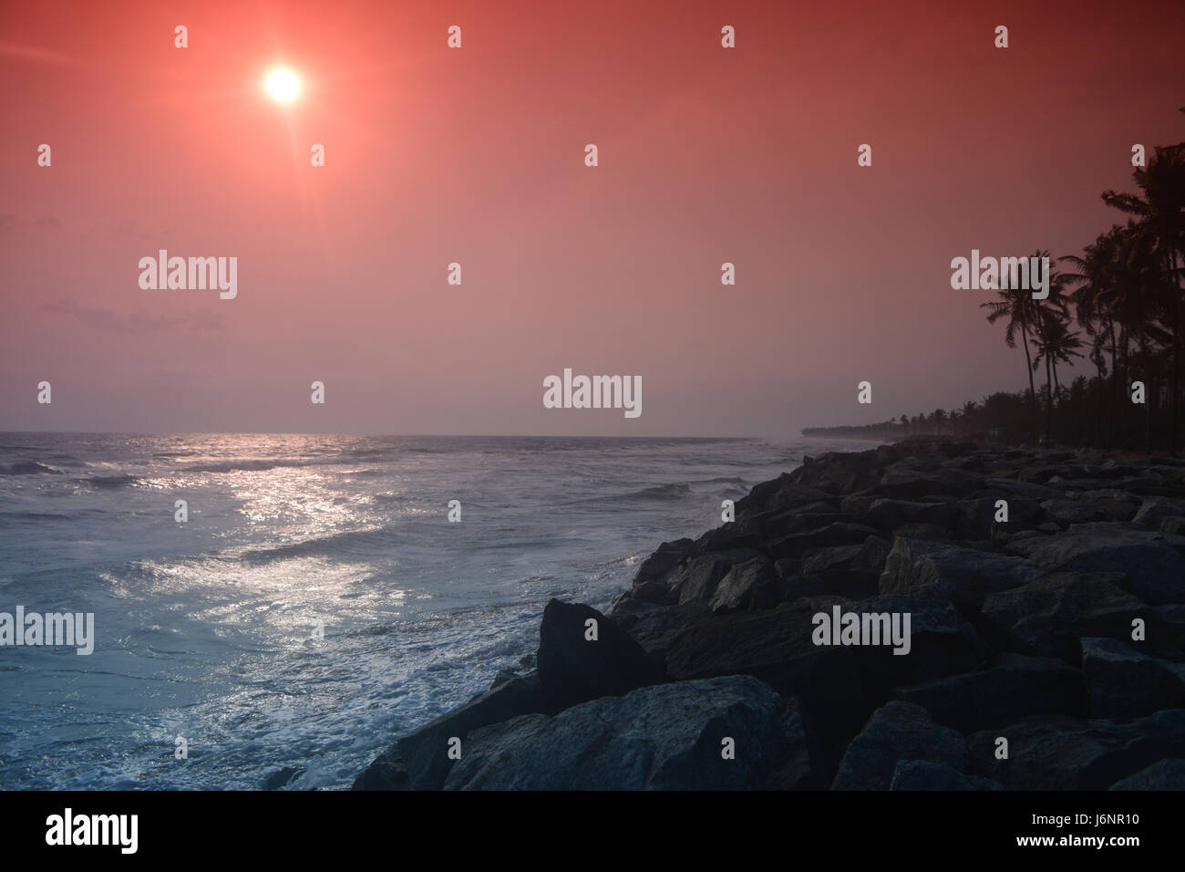 Trivandrum beach sunset Stock Photo - Alamy