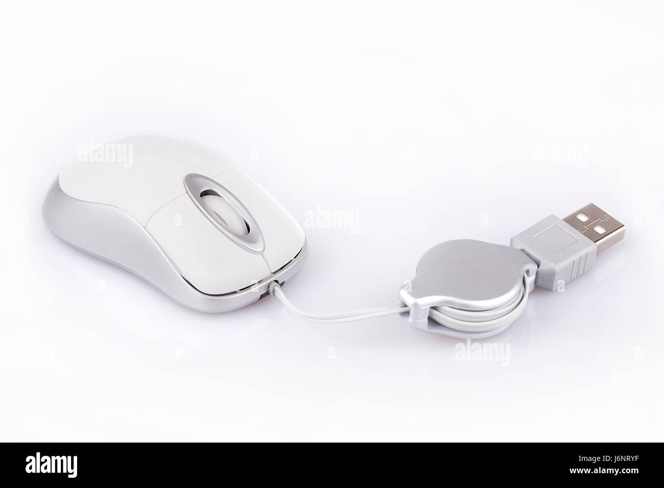 White computer mouse on a white surface. Mouse isolated on white ...