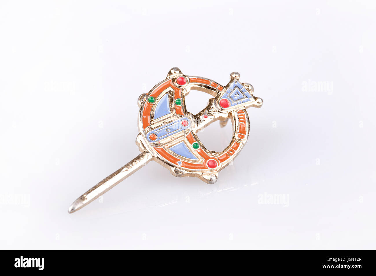 Irish pin on a white surface. Irish brooch isolated on white background ...