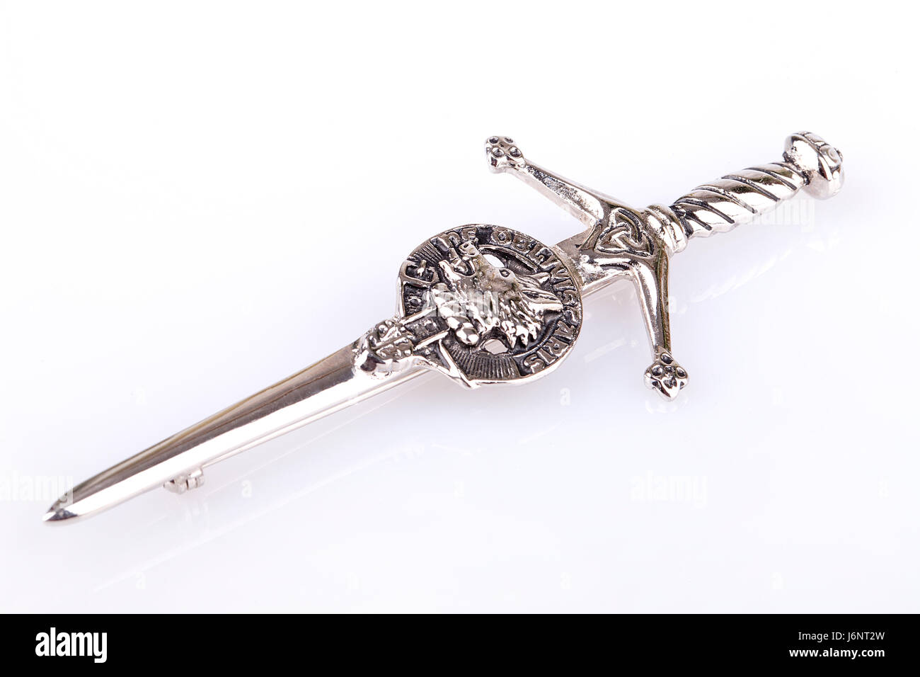 Irish pin on a white surface. Irish brooch isolated on white background ...