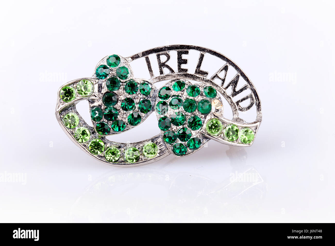 Irish pin on a white surface. Irish brooch isolated on white background ...