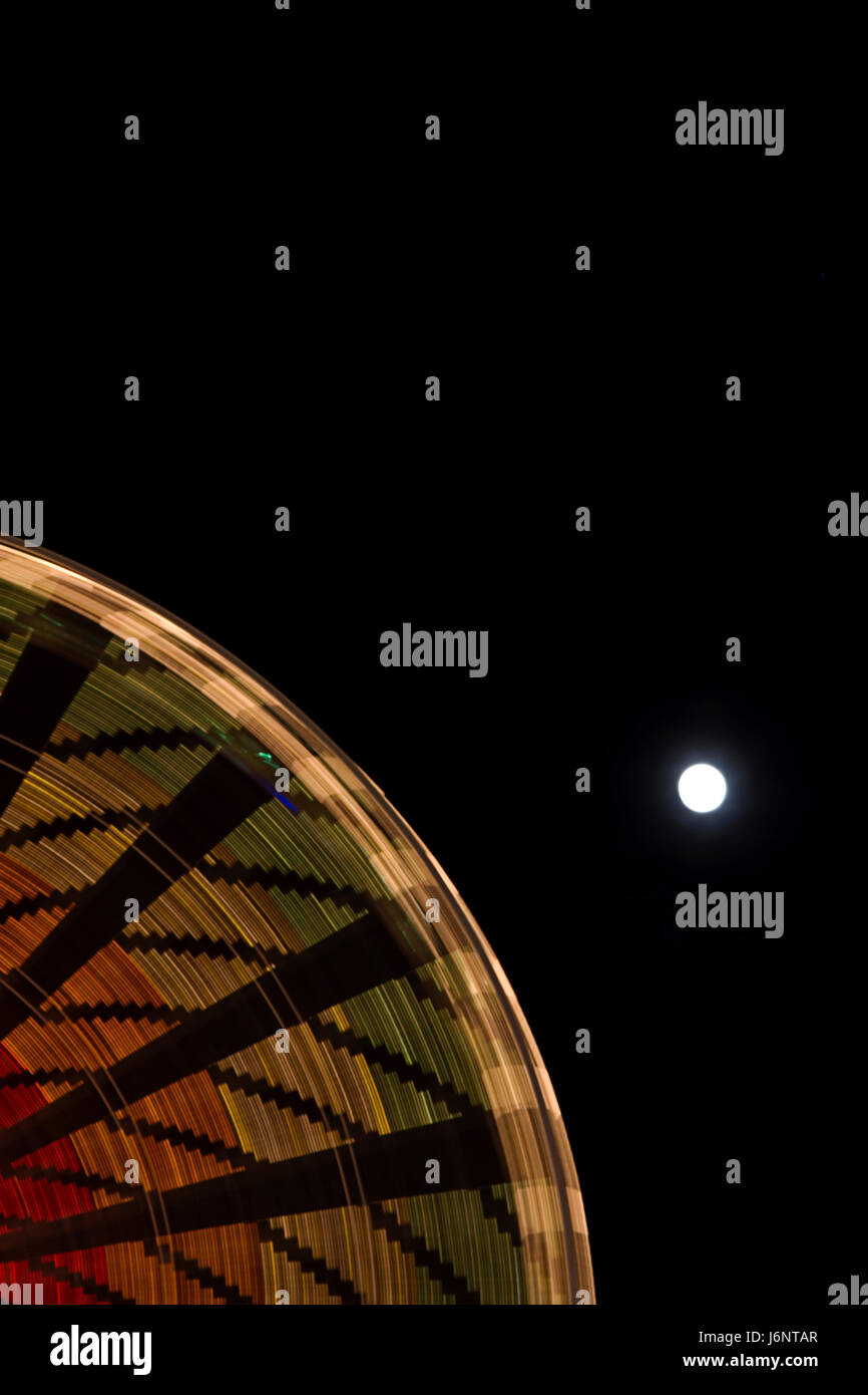 ferris wheel with moon Stock Photo - Alamy
