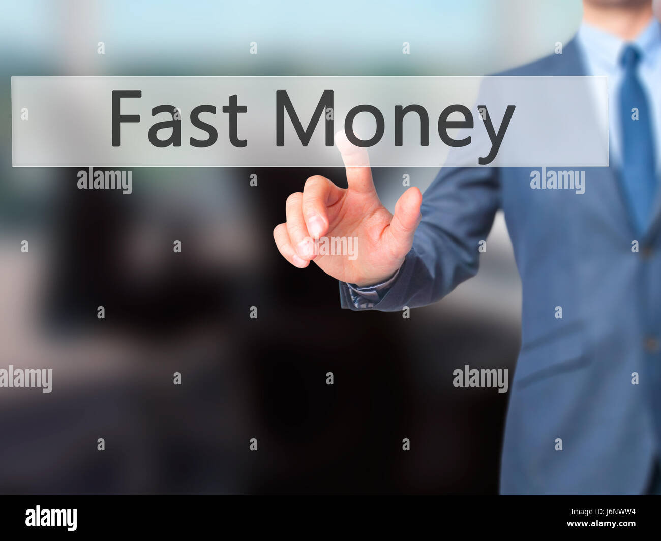 Fast Money - Businessman hand pressing button on touch screen interface ...