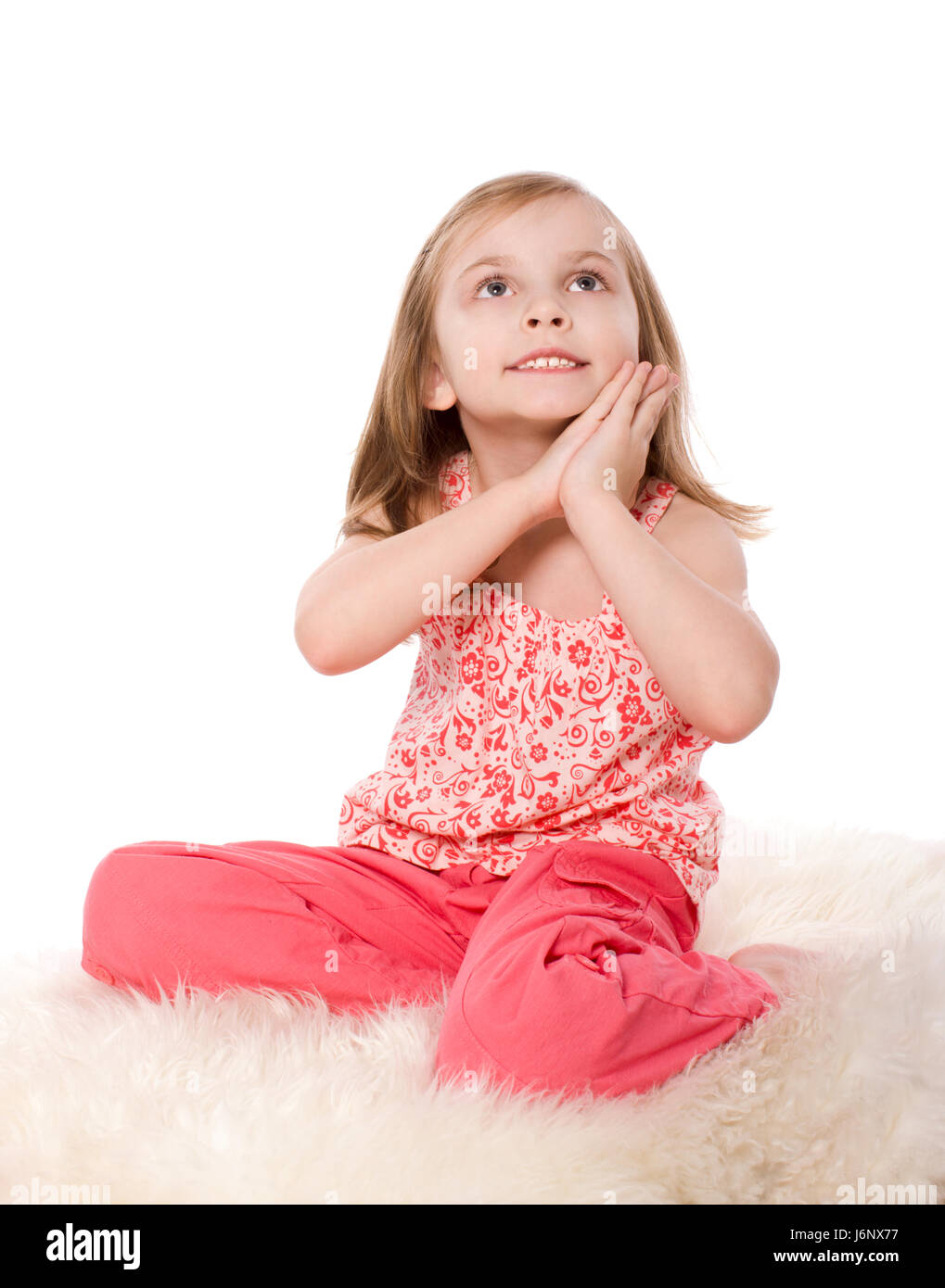Sitting little girl happy portrait isolated on white Stock Photo - Alamy
