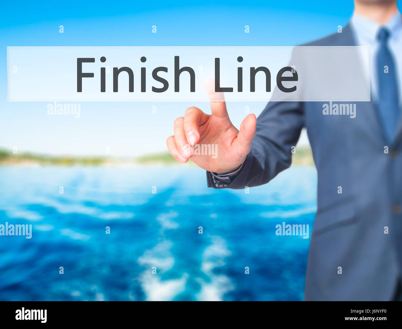 Finish Line - Businessman hand pressing button on touch screen ...