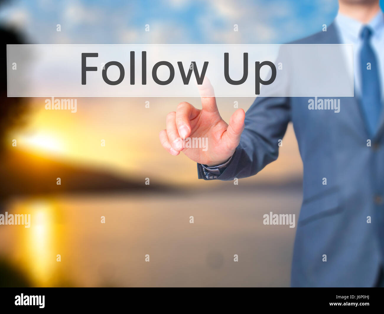 Follow Up - Businessman hand pressing button on touch screen interface ...