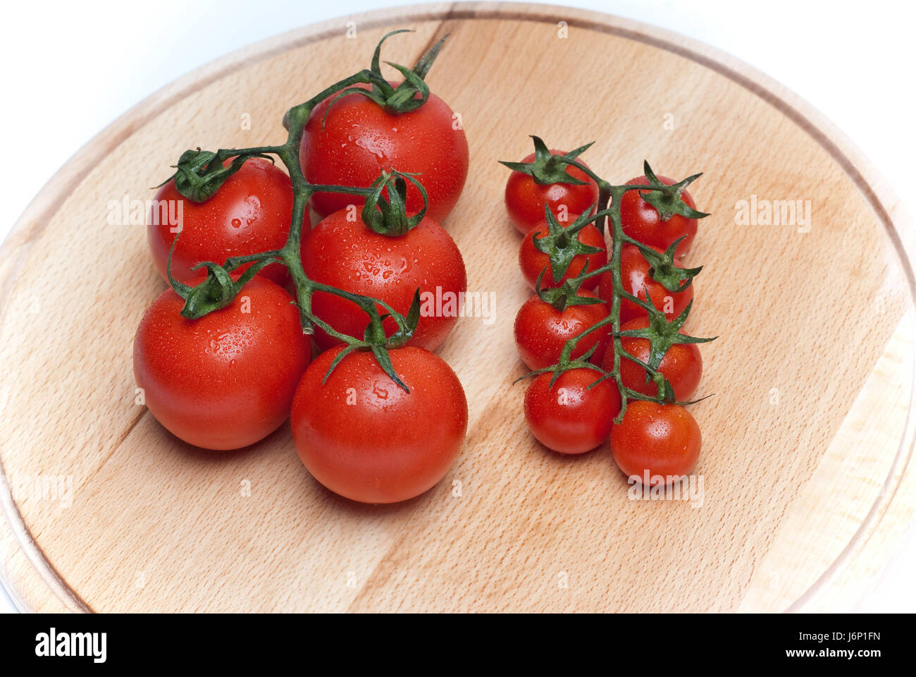 large and small tomatoes Stock Photo - Alamy