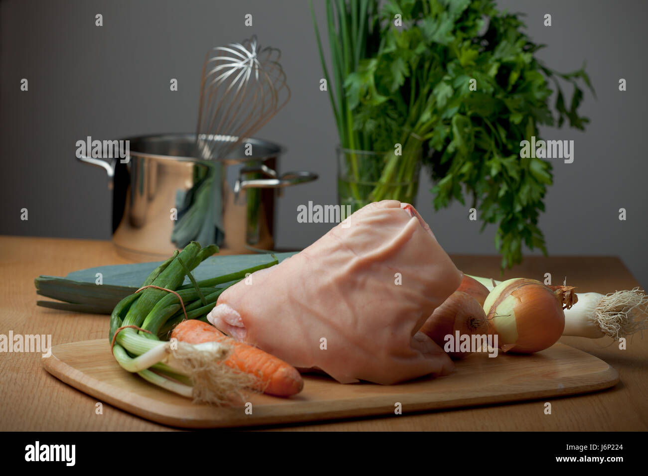 raw pork knuckle on a wooden table Stock Photo - Alamy