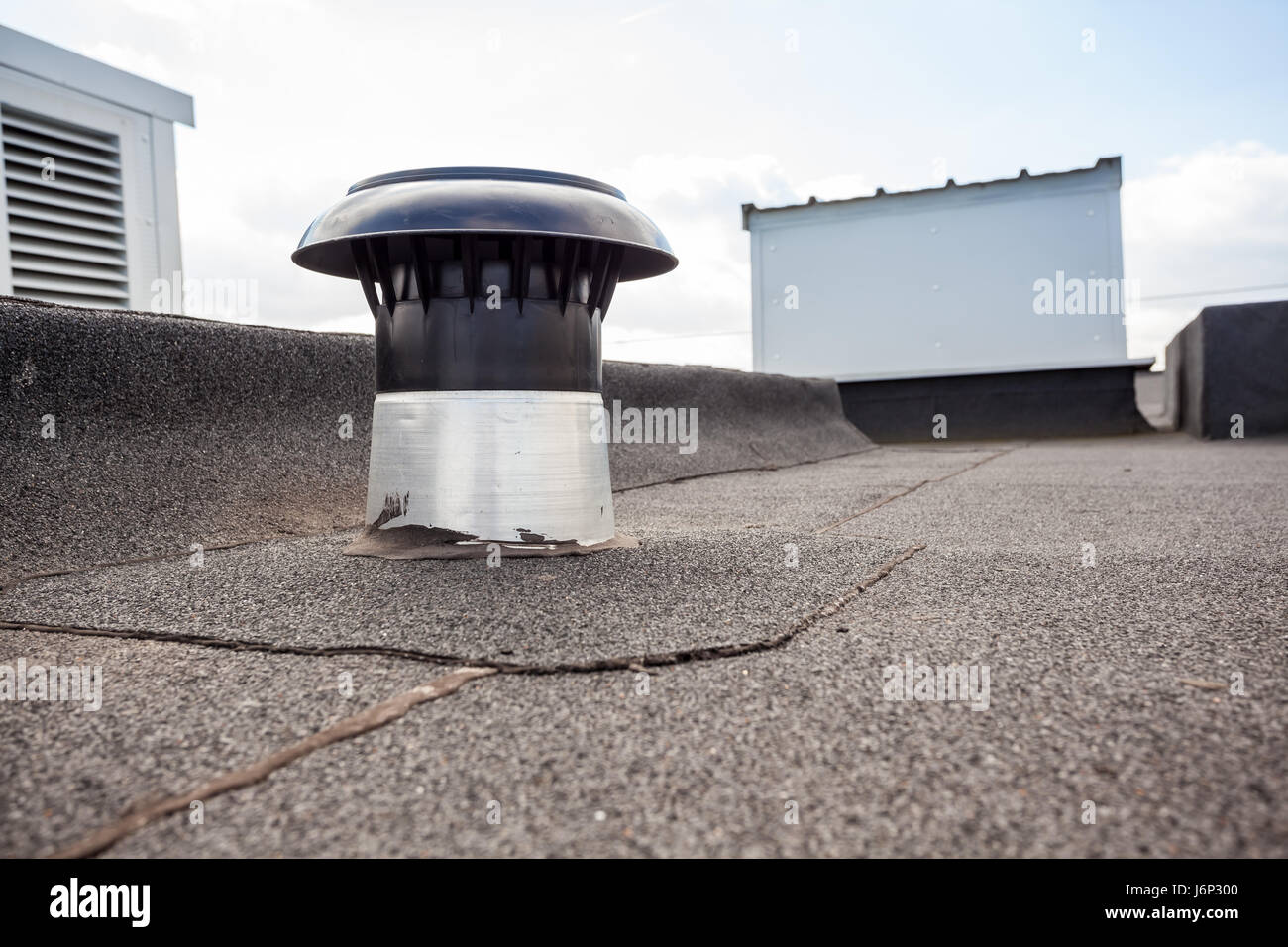 ventilators on the roof of a tall building in the industrial area Stock ...