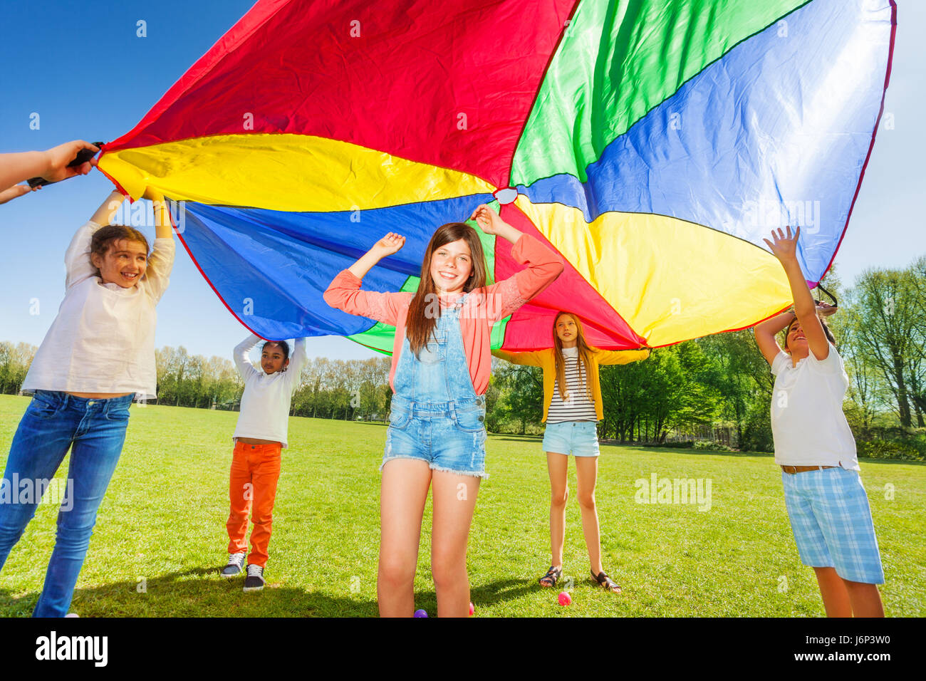 Kids parachute hi-res stock photography and images - Alamy