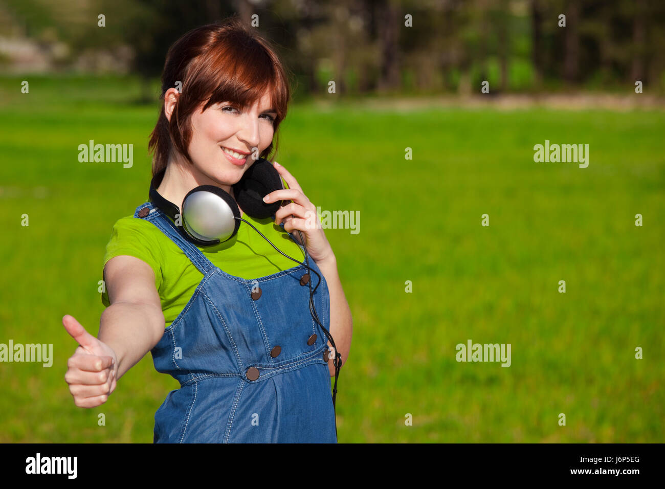 woman listen music spring bouncing bounces hop skipping frisks jumping ...