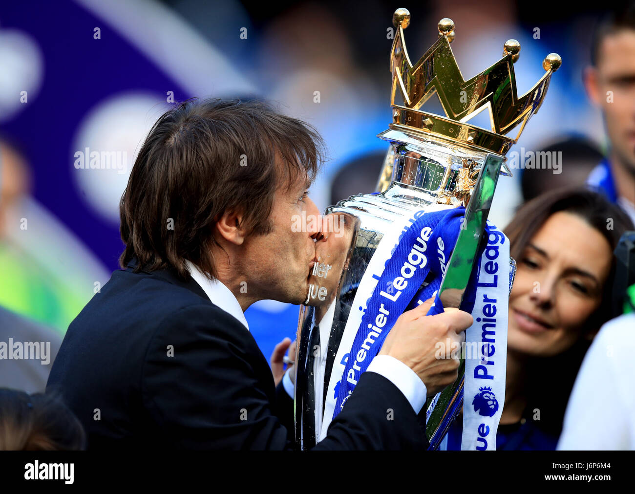 Chelsea manager Antonio Conte kisses the Premier League Trophy during ...