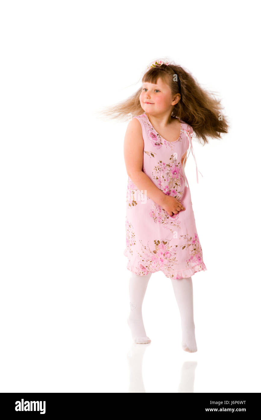 Cheerful girl spinning on floor isolated on white Stock Photo - Alamy