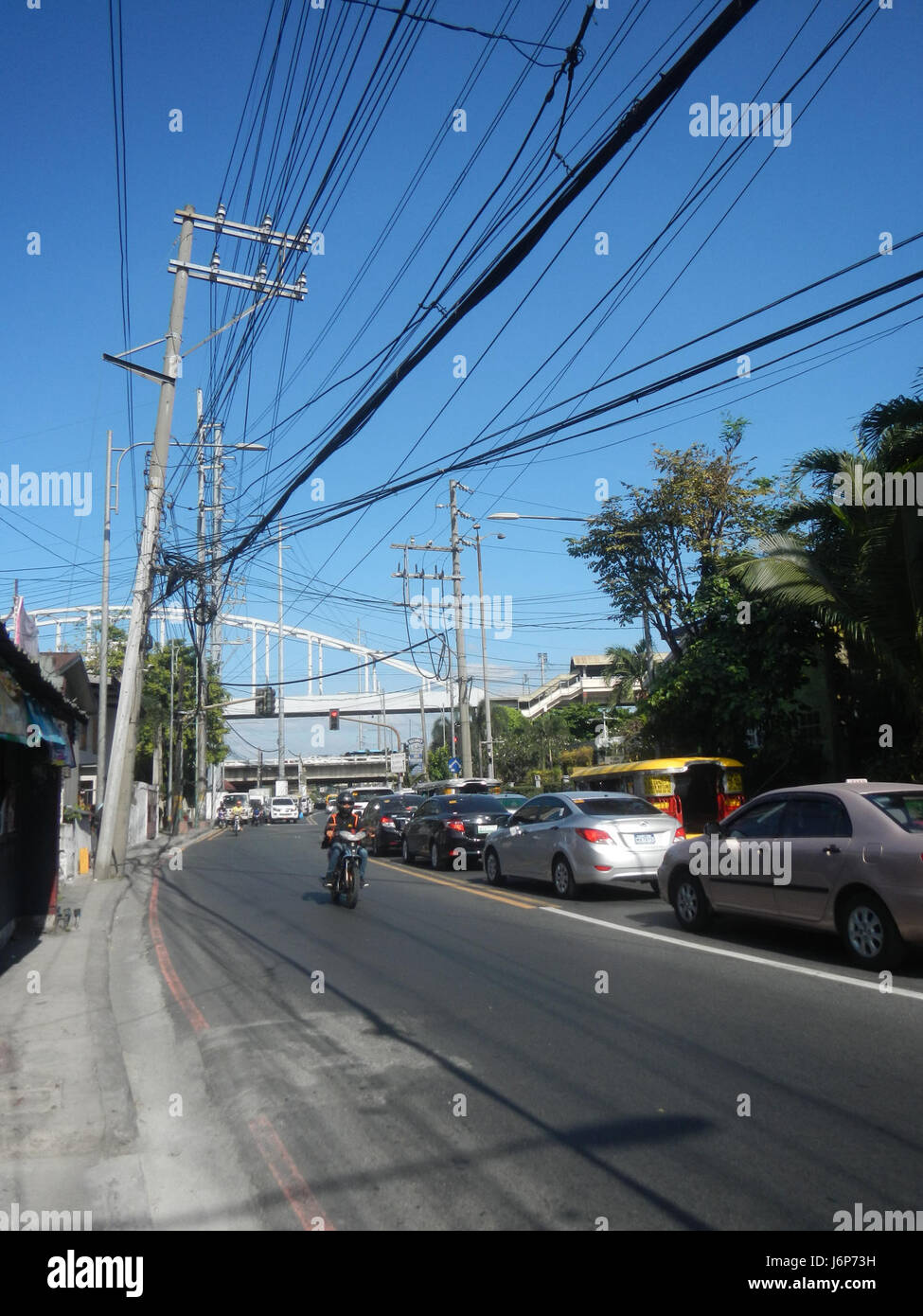 This image shows a street view of J.P. Rizal Avenue in the Poblacion ...