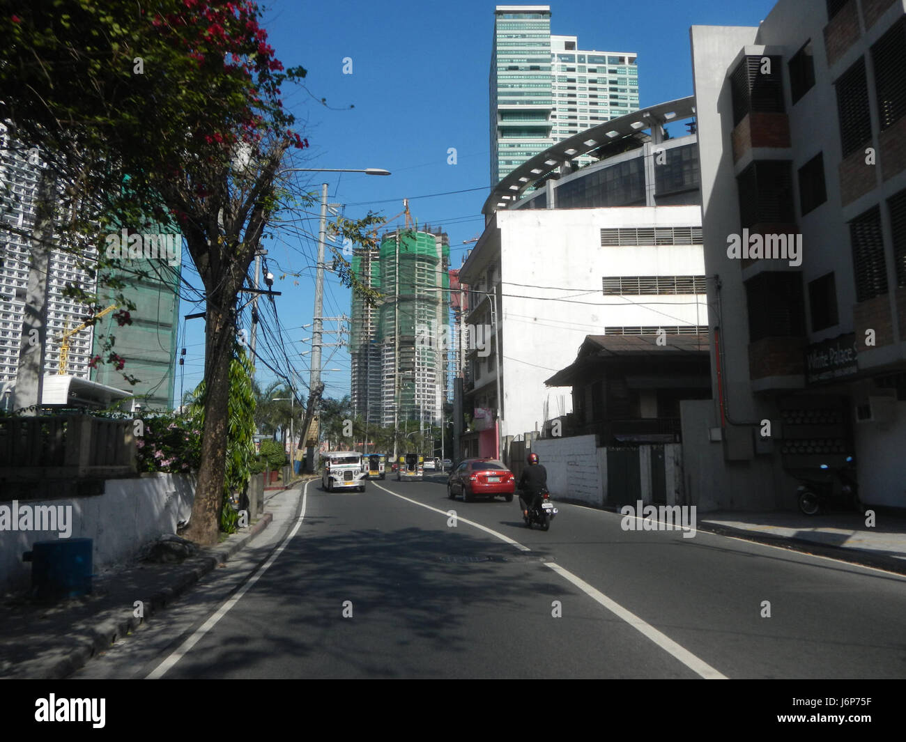 A detailed street view of J. P. Rizal Avenue in the Poblacion area ...