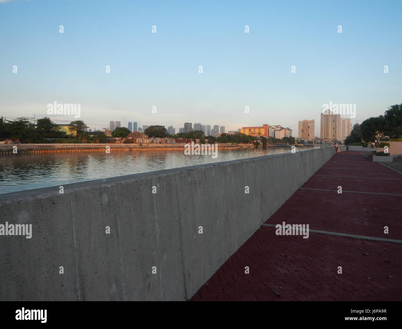This image from Carmona showcases the sunset along the riverfront, with ...