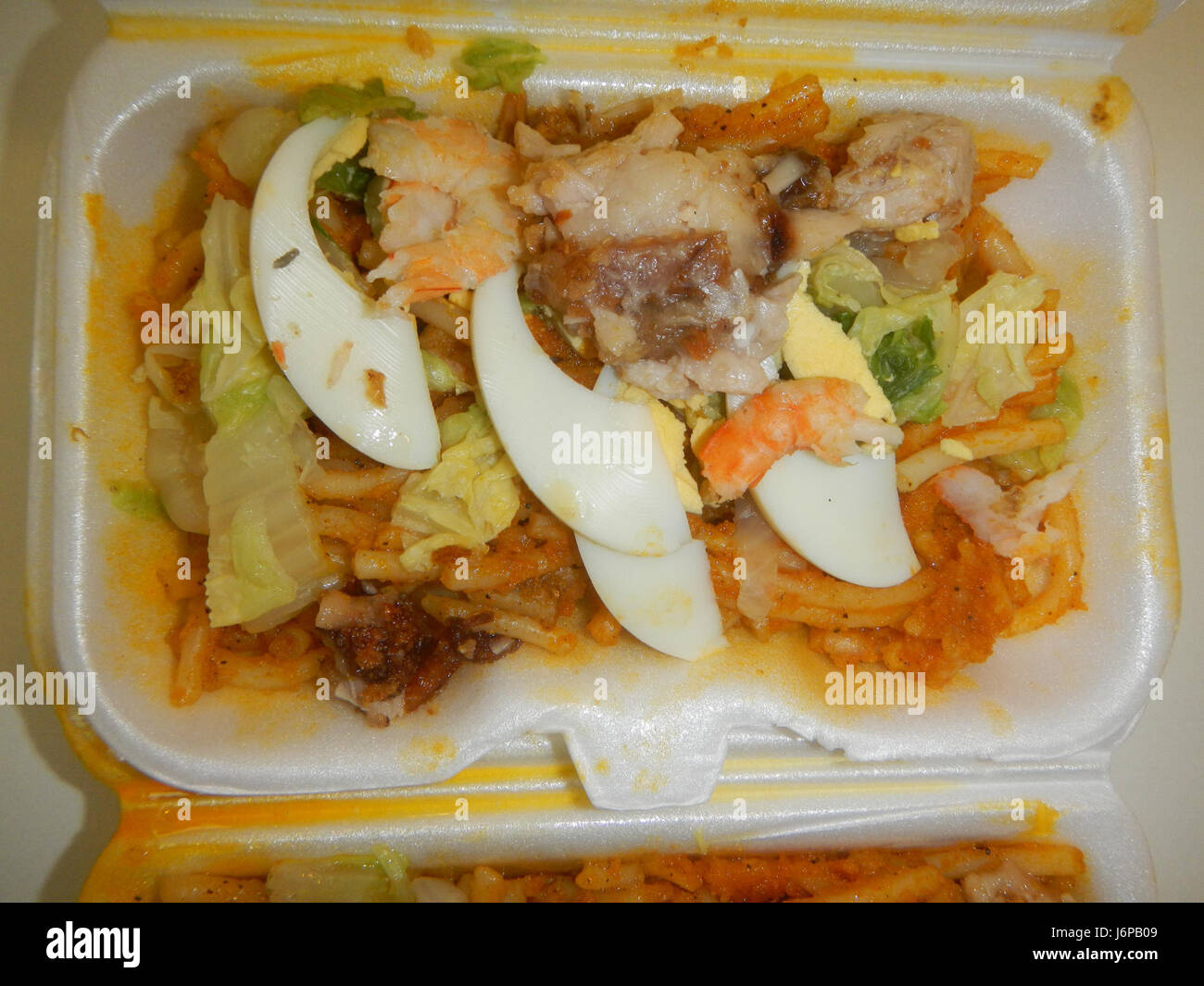 Pancit Malabon is a Filipino noodle dish from Bulacan, renowned for its ...
