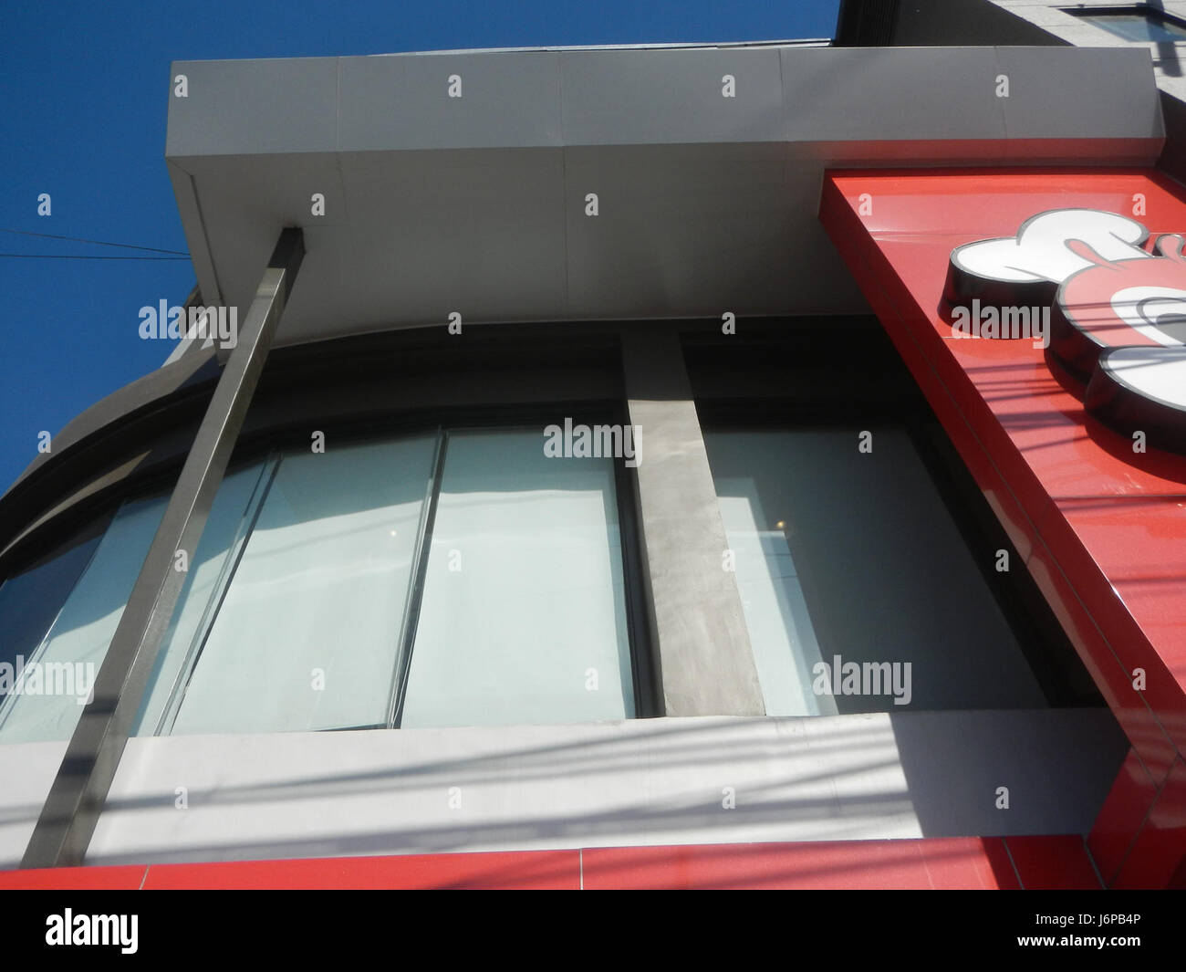 This photograph depicts the vibrant street scene of C. Dizon Avenue in ...