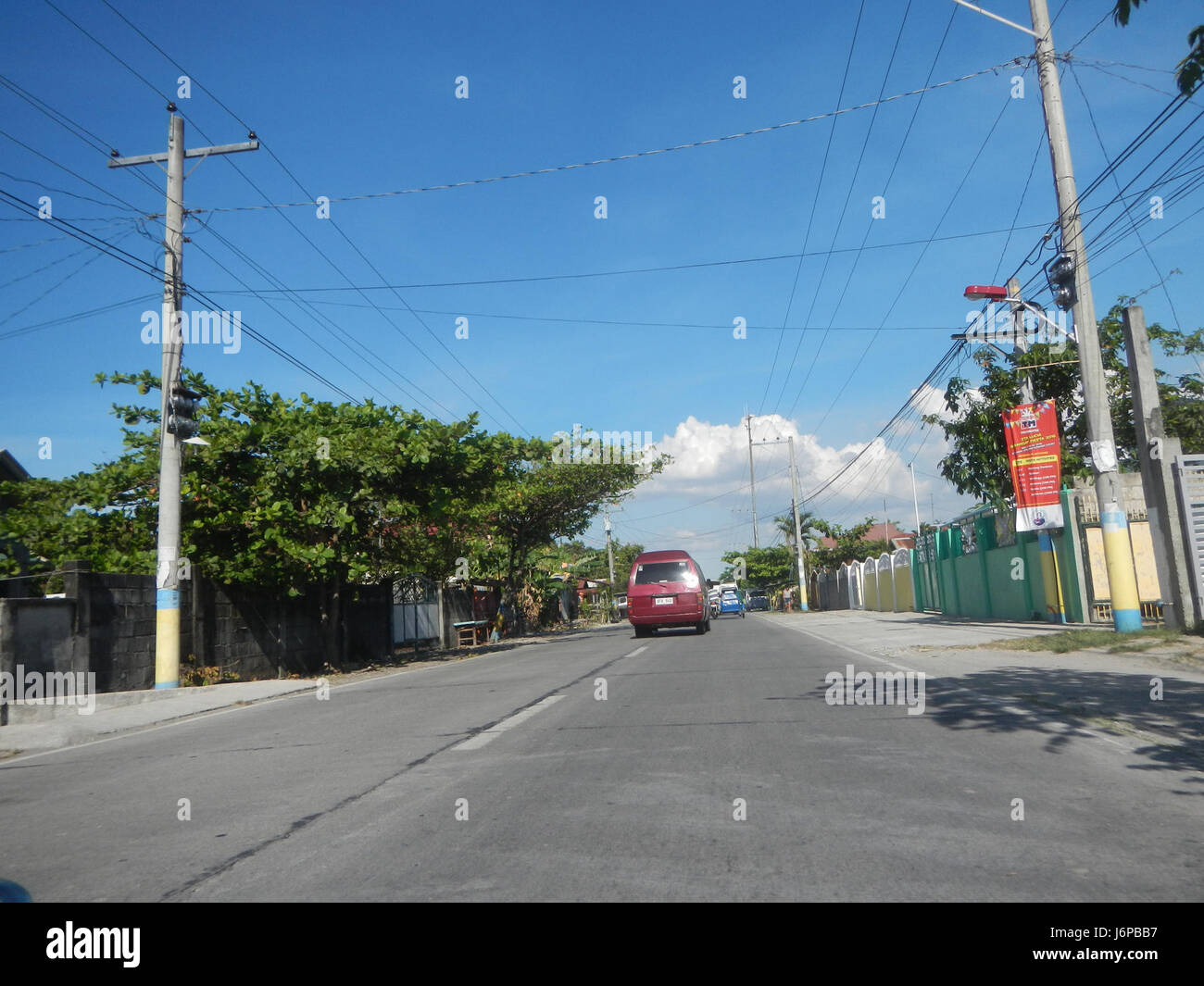 This image highlights a section of the National Road in the Philippines ...