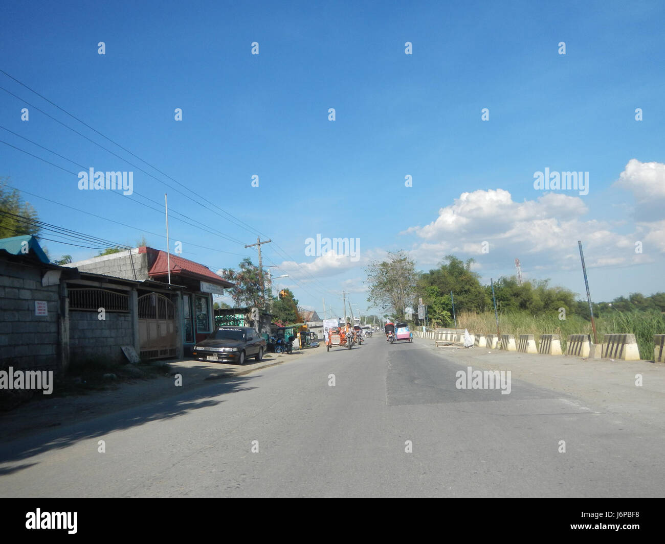 An image of the Candaba Santa Ana National Road in Pampanga, featuring ...