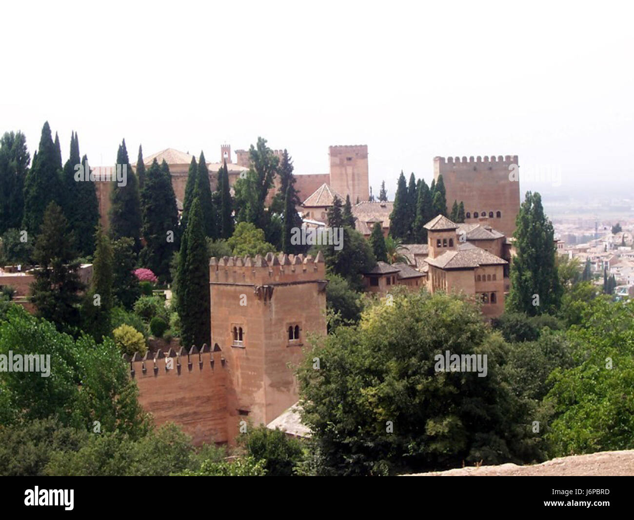 This image depicts the Alhambra, a famous historical palace and ...