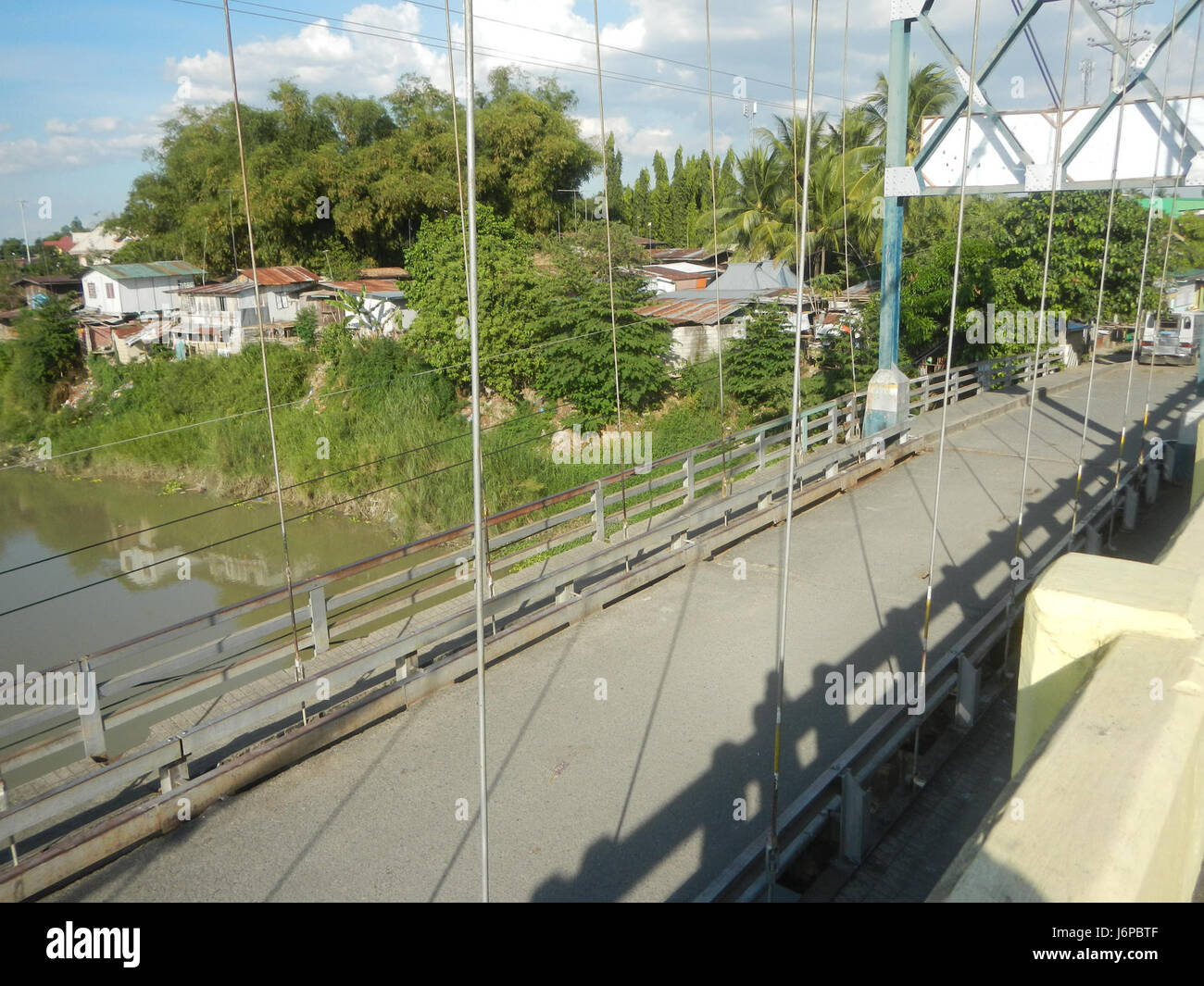 This image depicts the old and new bridges across the Pampanga River in ...