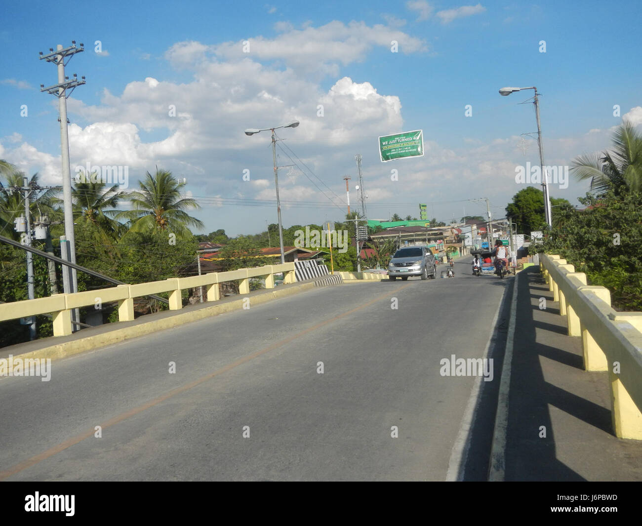 This photograph shows Candaba Town Proper with both old and new bridges ...