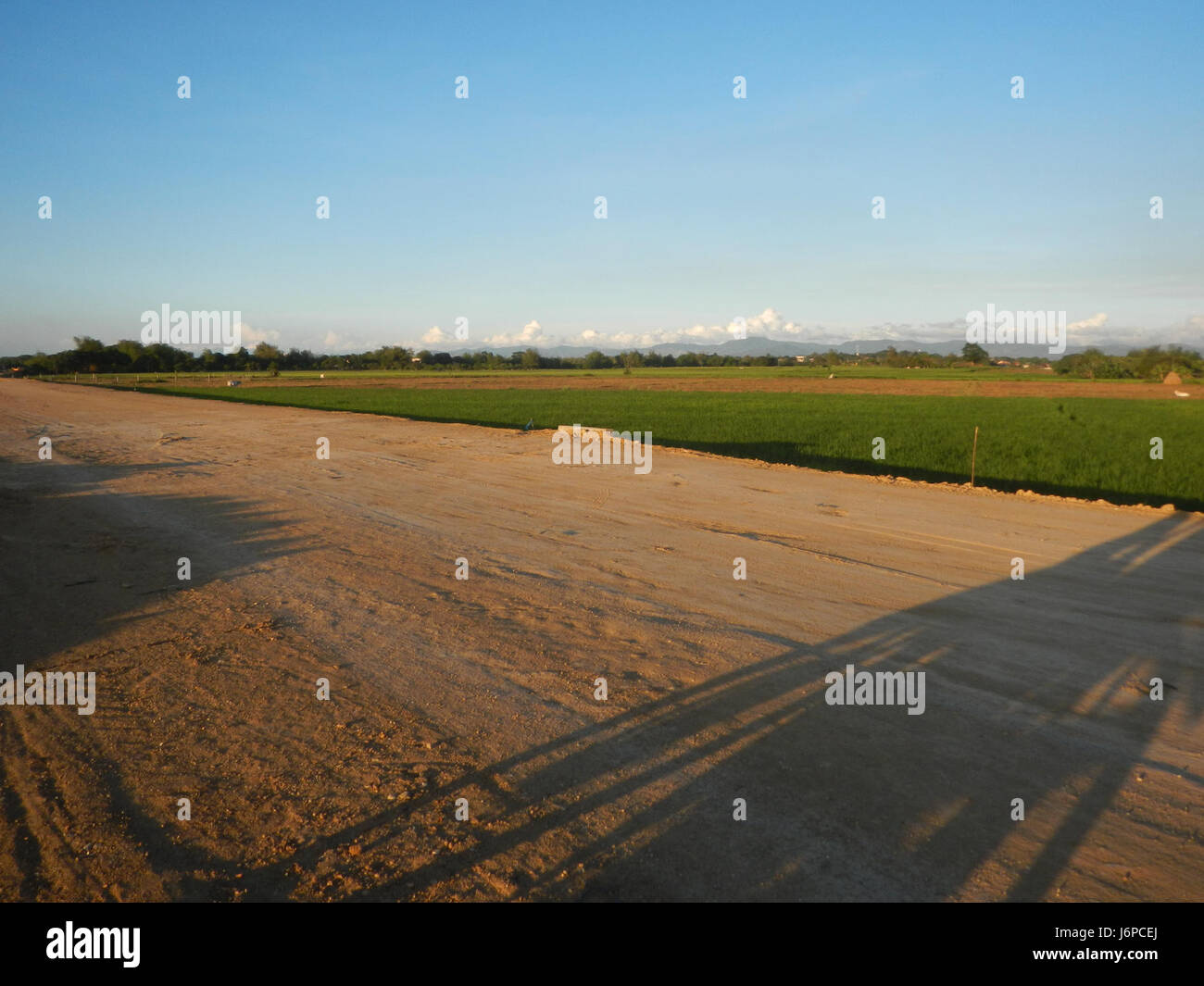 This image depicts the paddy fields and surrounding landscape along the ...