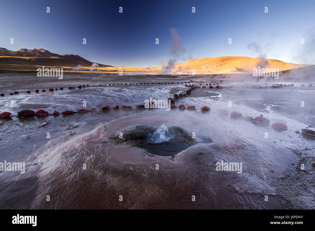 geyser tatio with water surface at sunrise Stock Photo - Alamy