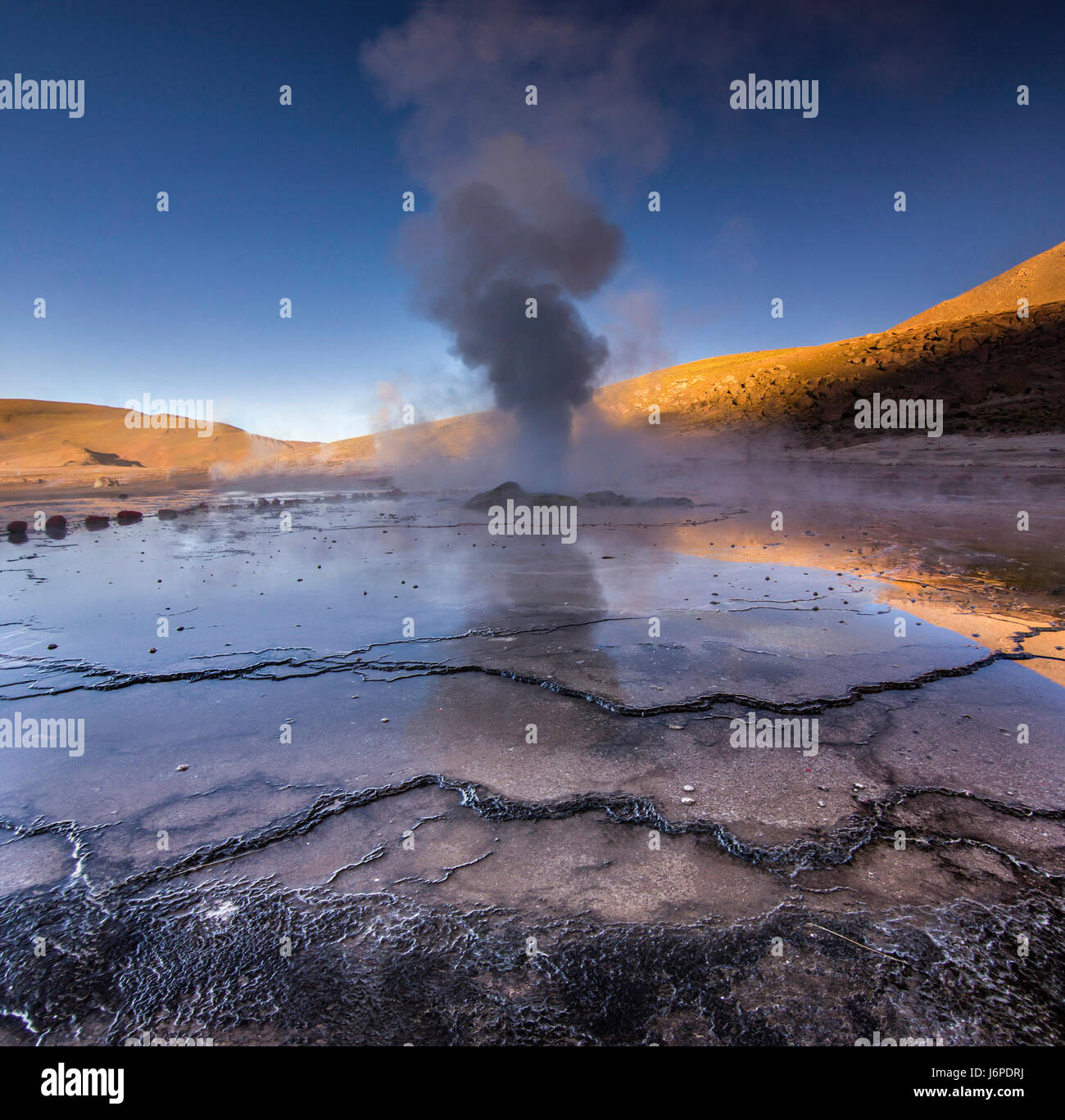 geyser tatio with water surface at sunrise Stock Photo - Alamy