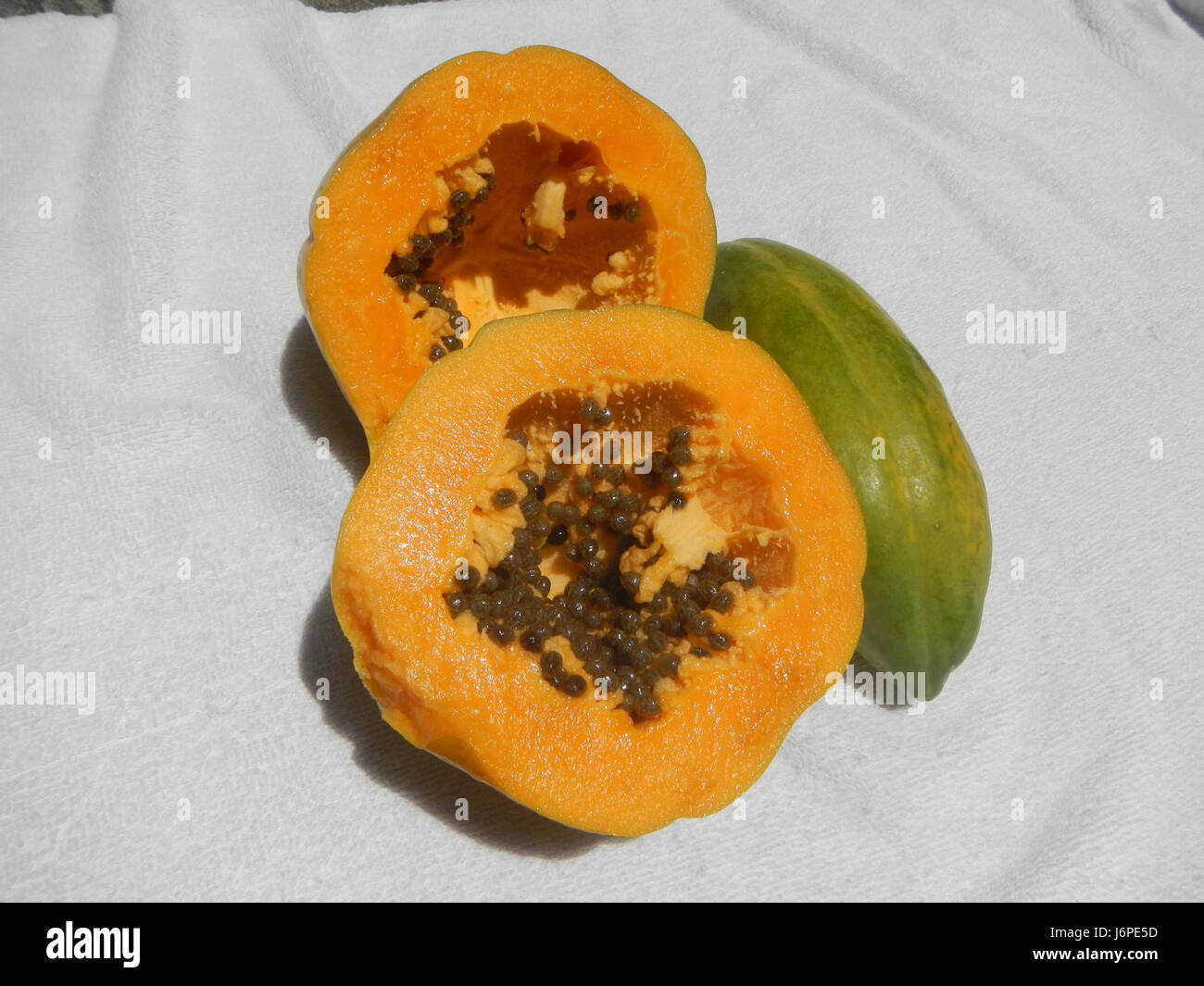 This image features a variety of fruits, including mangoes and papayas ...