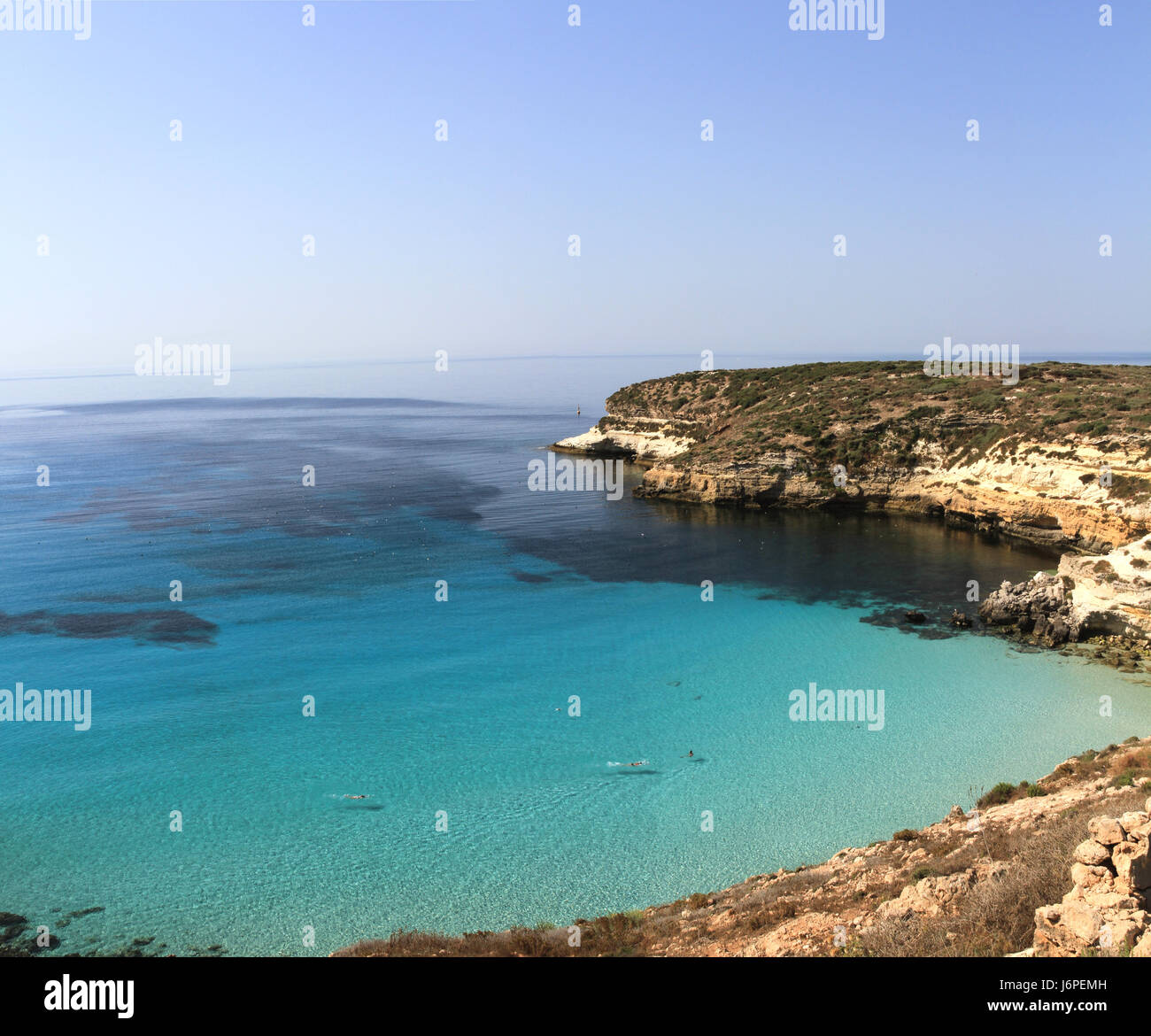 Pure crystalline water surface around an island - Lampedusa, Sicily ...