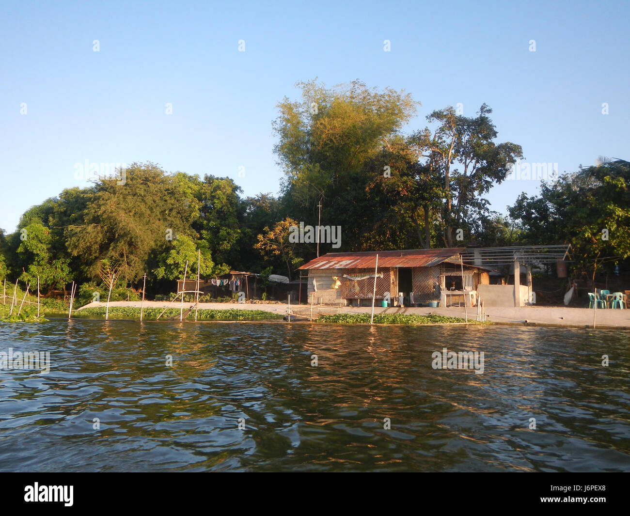 This image captures the riverside districts of Calumpit, Bulacan, with ...