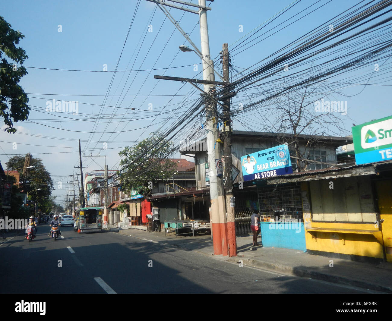 This photo depicts a busy urban street scene at the intersection of Dr ...