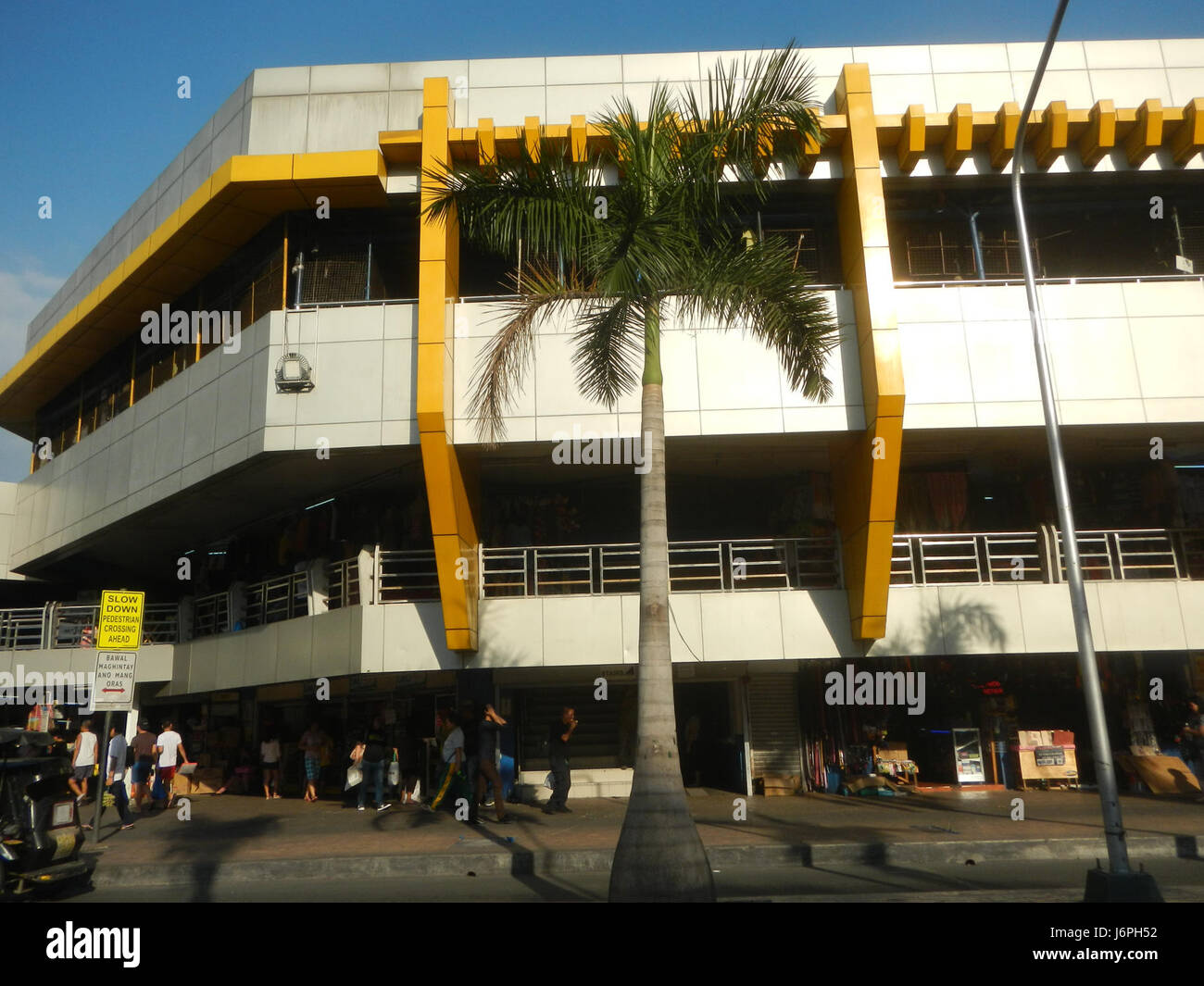 The image depicts Pasig City Hall and surrounding structures, including ...