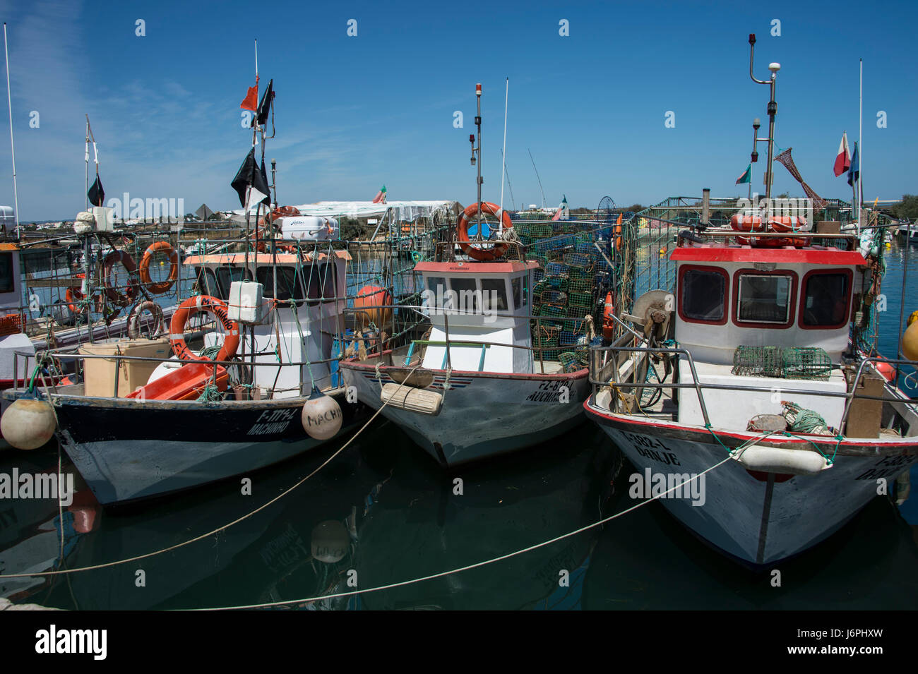 Portuguese fishing boats moored in Fuseta in the Algarve Stock Photo ...