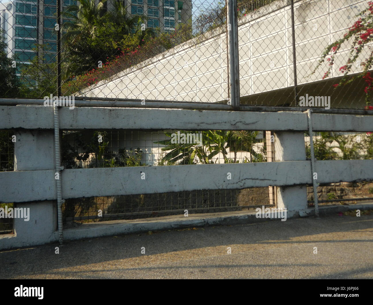 This image depicts the Zuellig Building, a modern skyscraper located in ...