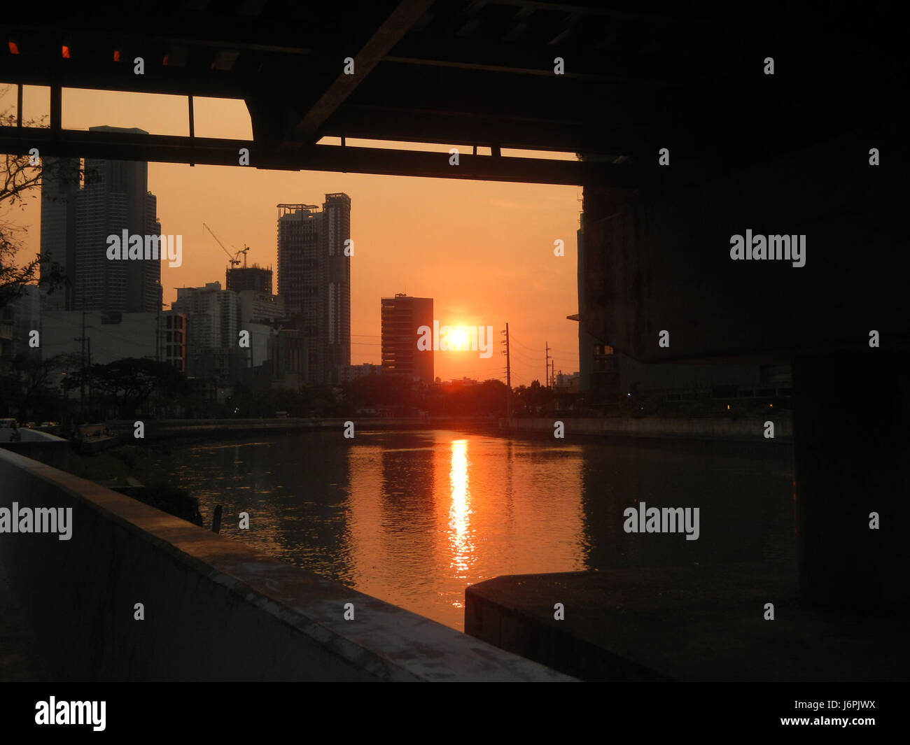 This image captures the sunset view over Century City in Makati, a ...