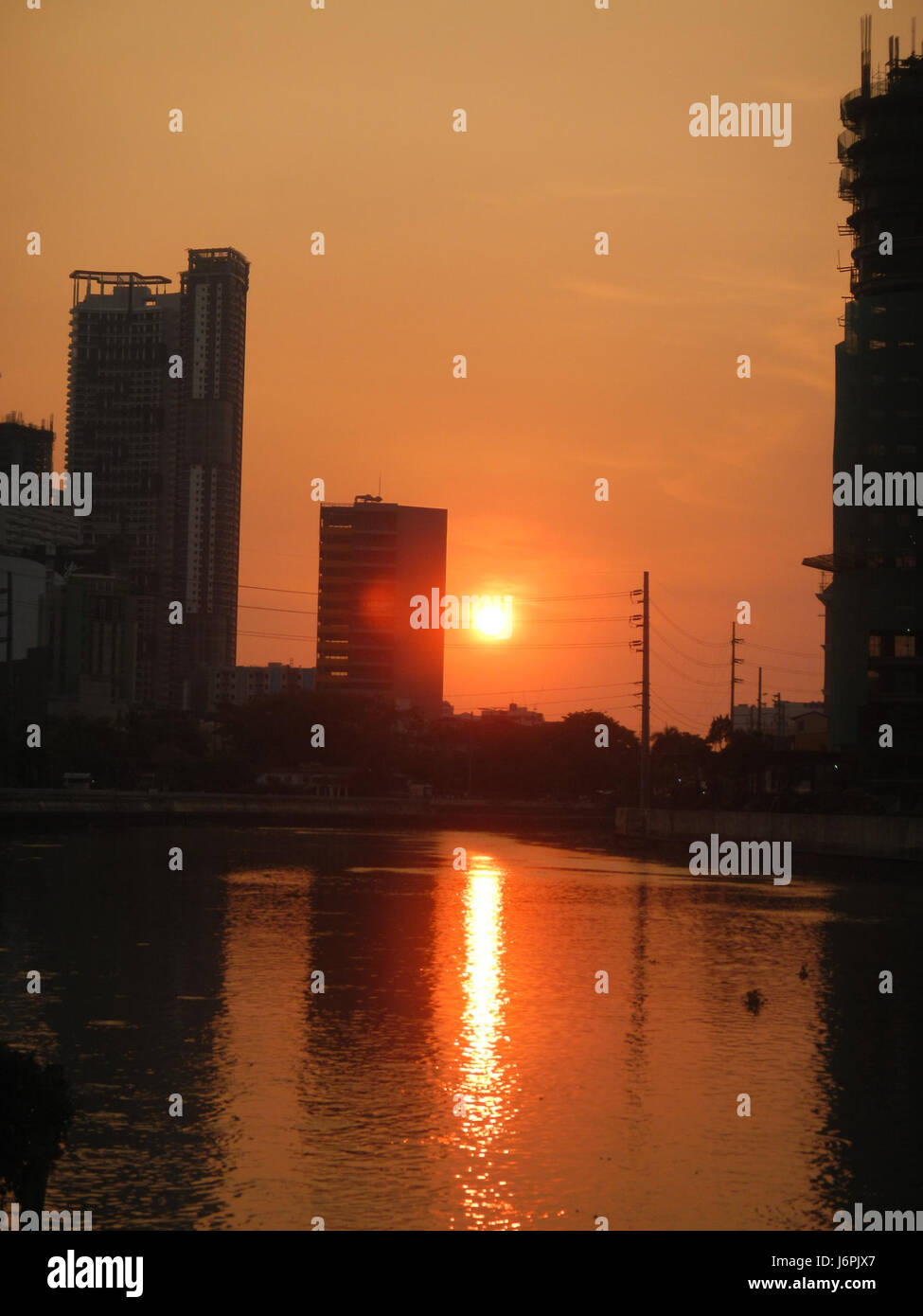 This photograph captures the sunset in the urban landscapes of Makati ...