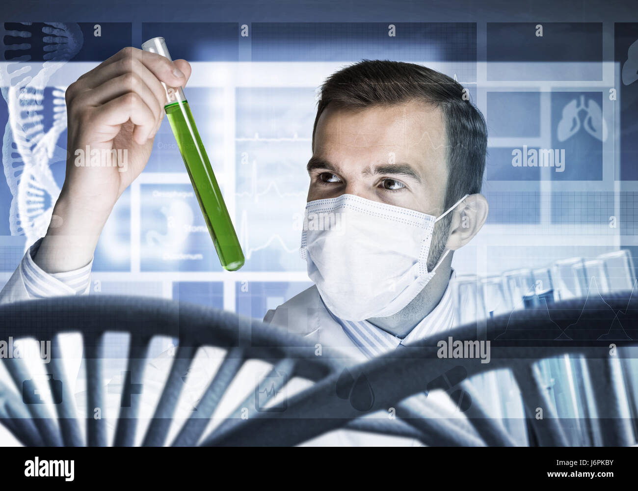 Young scientist mixing reagents in glass flask in clinical laboratory ...